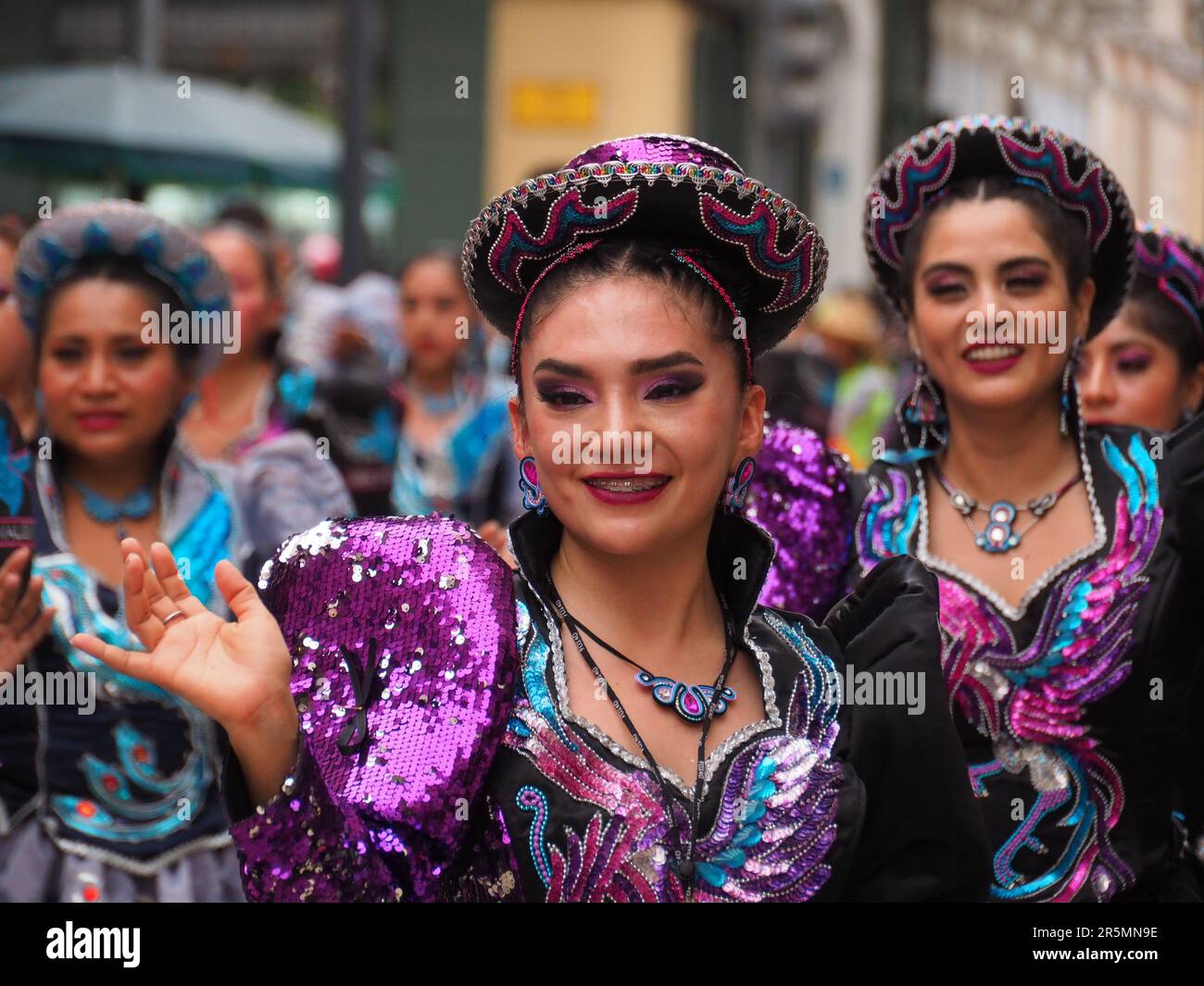 Troupe of women performing a dance, and wearing traditional costumes ...