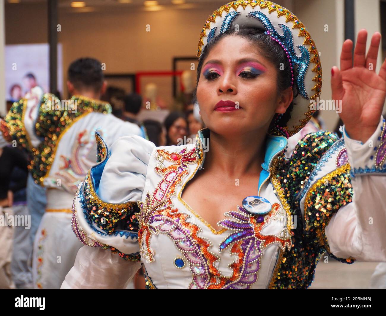 Troupe of women performing a dance, and wearing traditional costumes ...