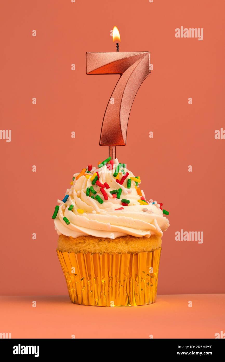 Birthday cake with candle number 7 - Coral fusion background Stock ...
