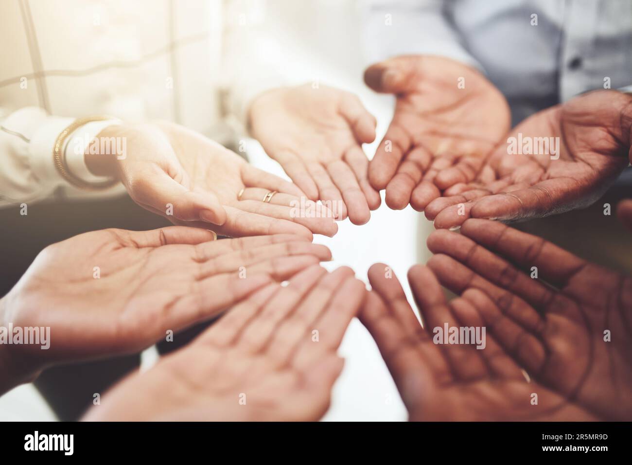 Extend a helping hand where you can. Closeup shot of a group of ...