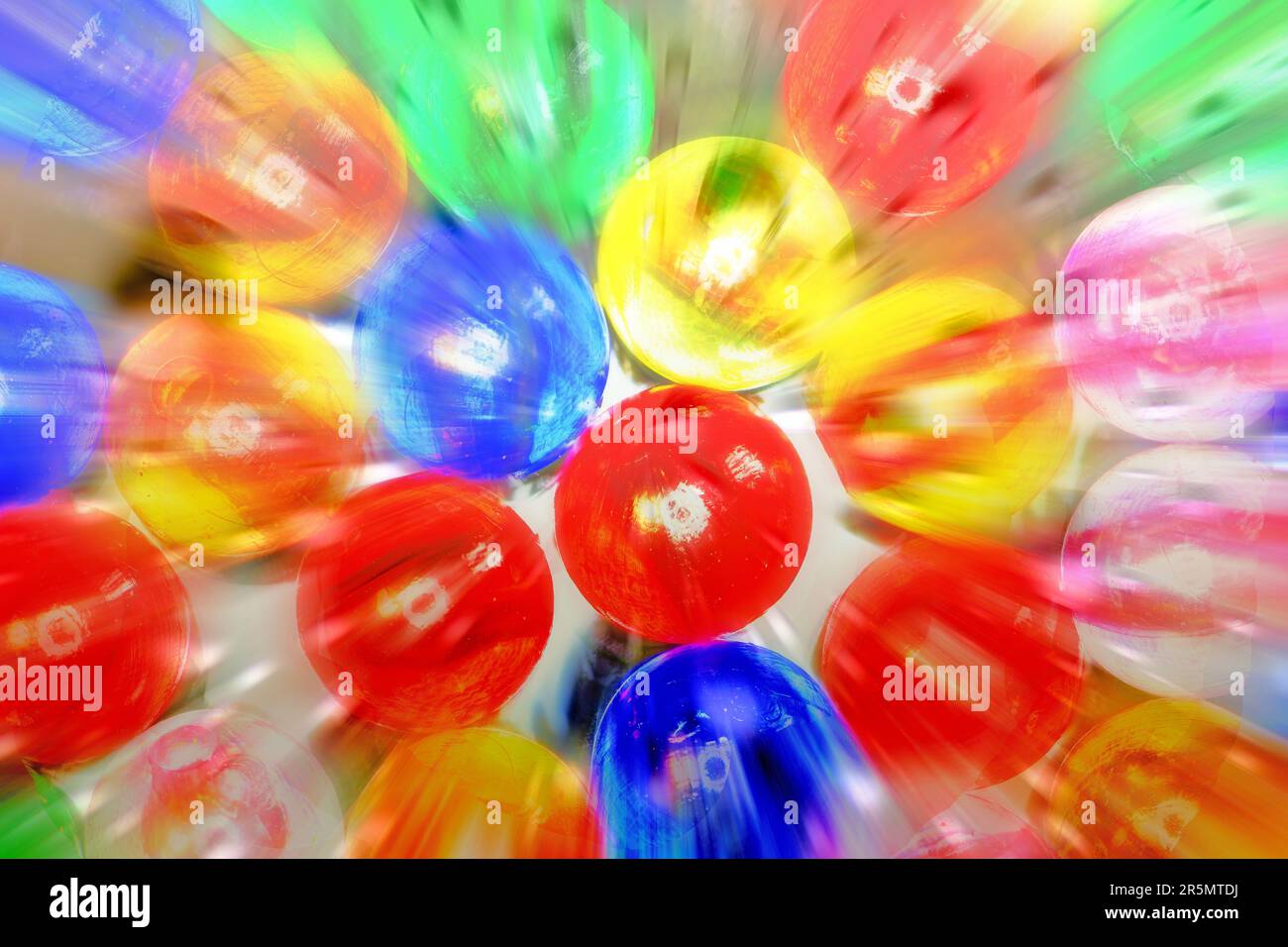 Multi coloured glass balls in a motion blur with rain pattern Stock ...