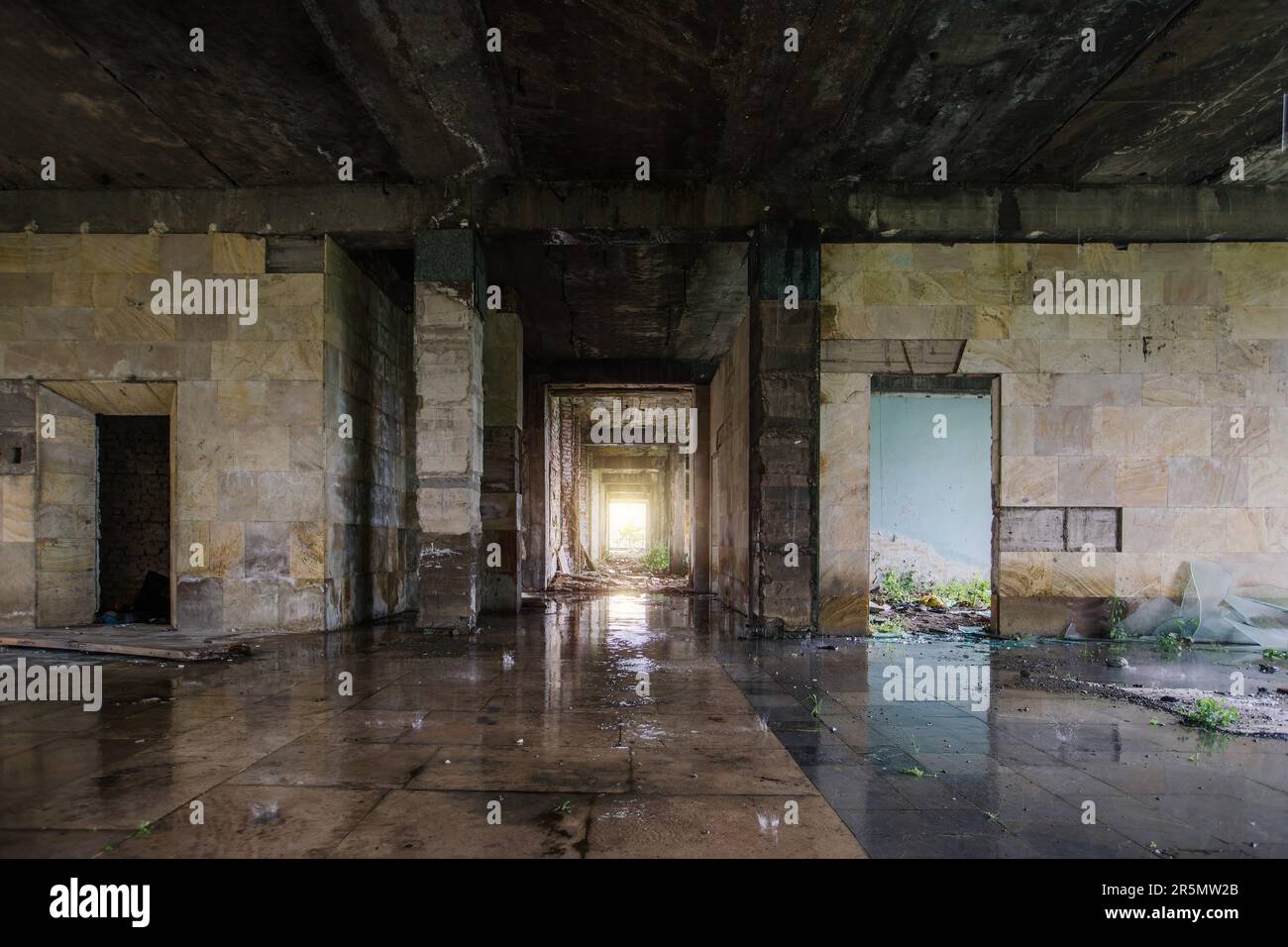 Inside of flooded dirty abandoned ruined industrial building with water ...