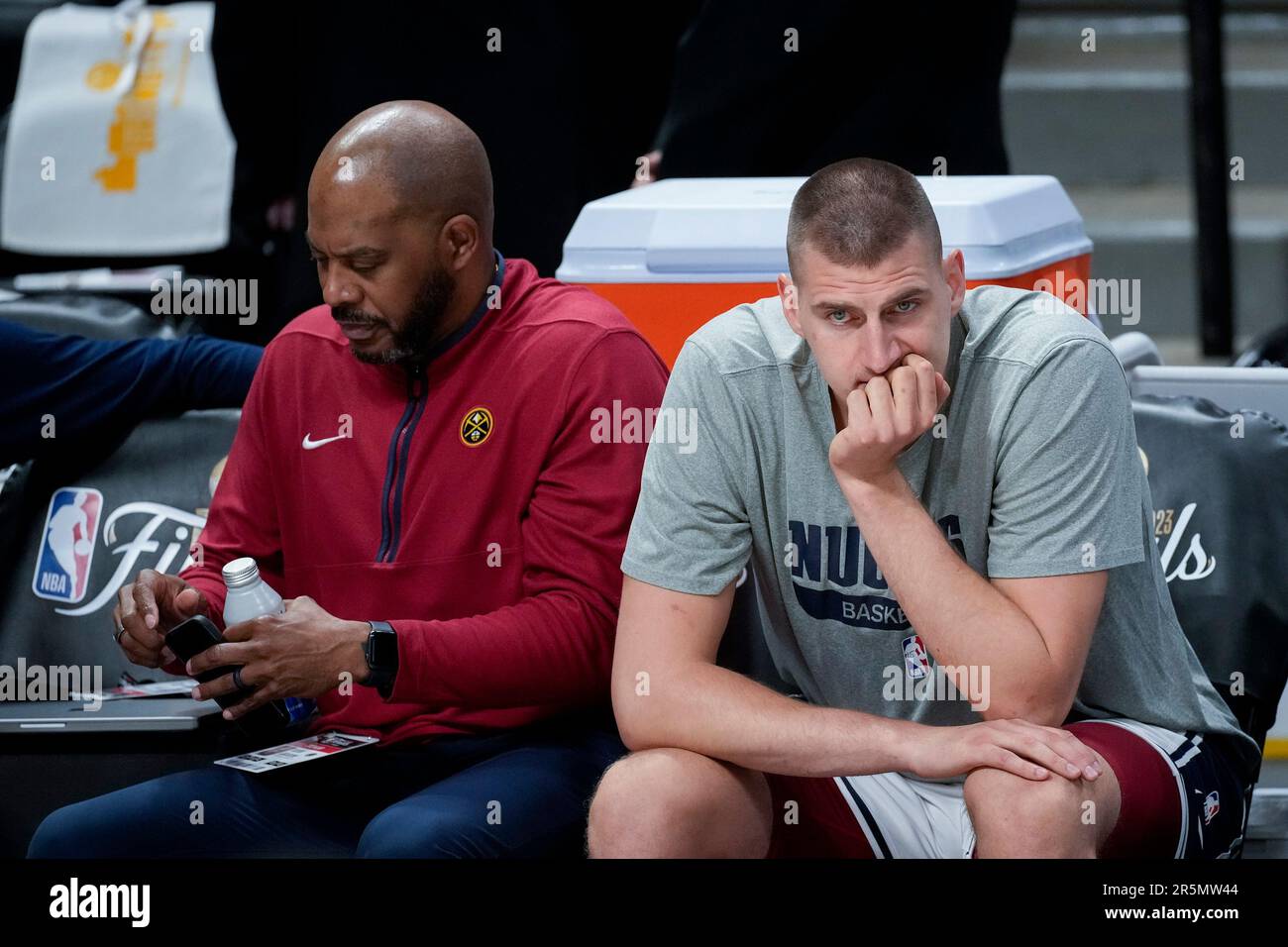 Denver Nuggets center Nikola Jokic, right, sits on the bench during ...