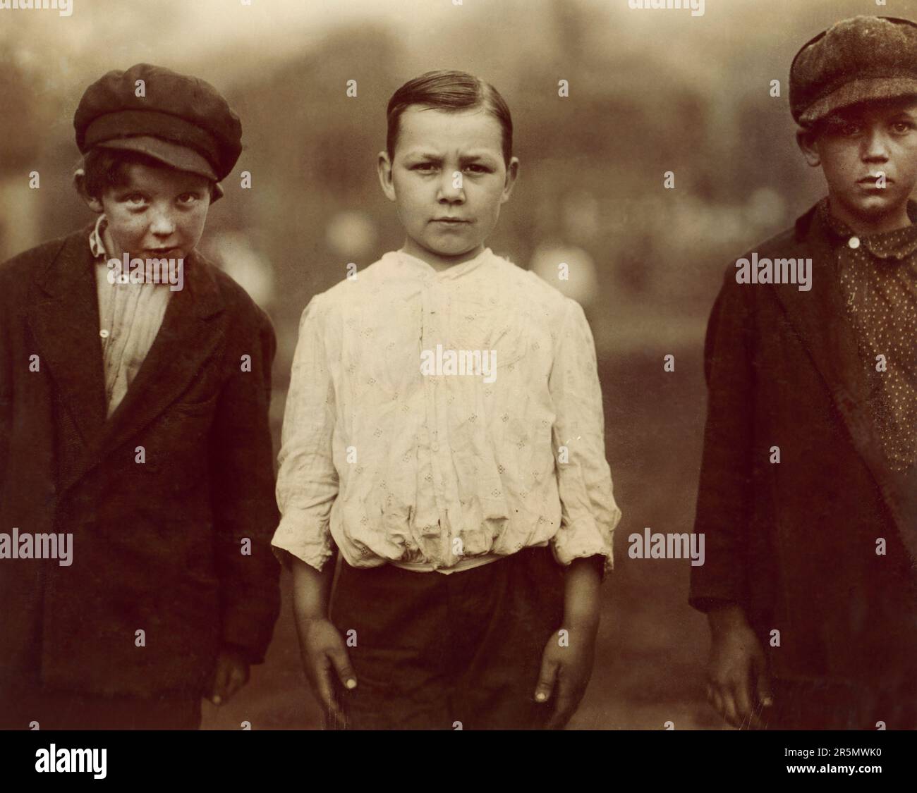 Three young boys, ages 9 to 11, turn stockings in hosiery mill, Rome ...