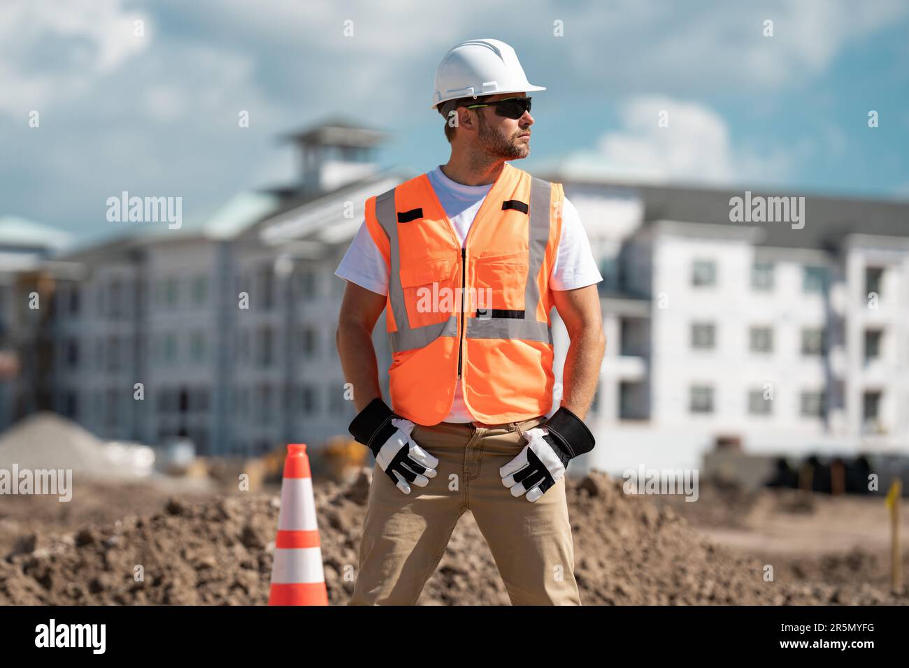 Construction builder in building uniform on buildings construction ...