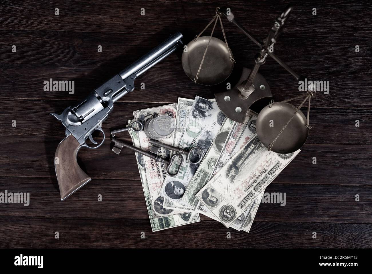 Old west Colt revolver and US banknotes and silver certificates with ...