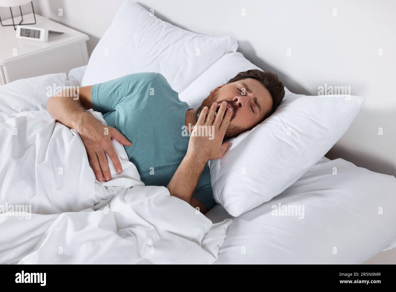 Handsome man yawning on hi-res stock photography and images - Alamy