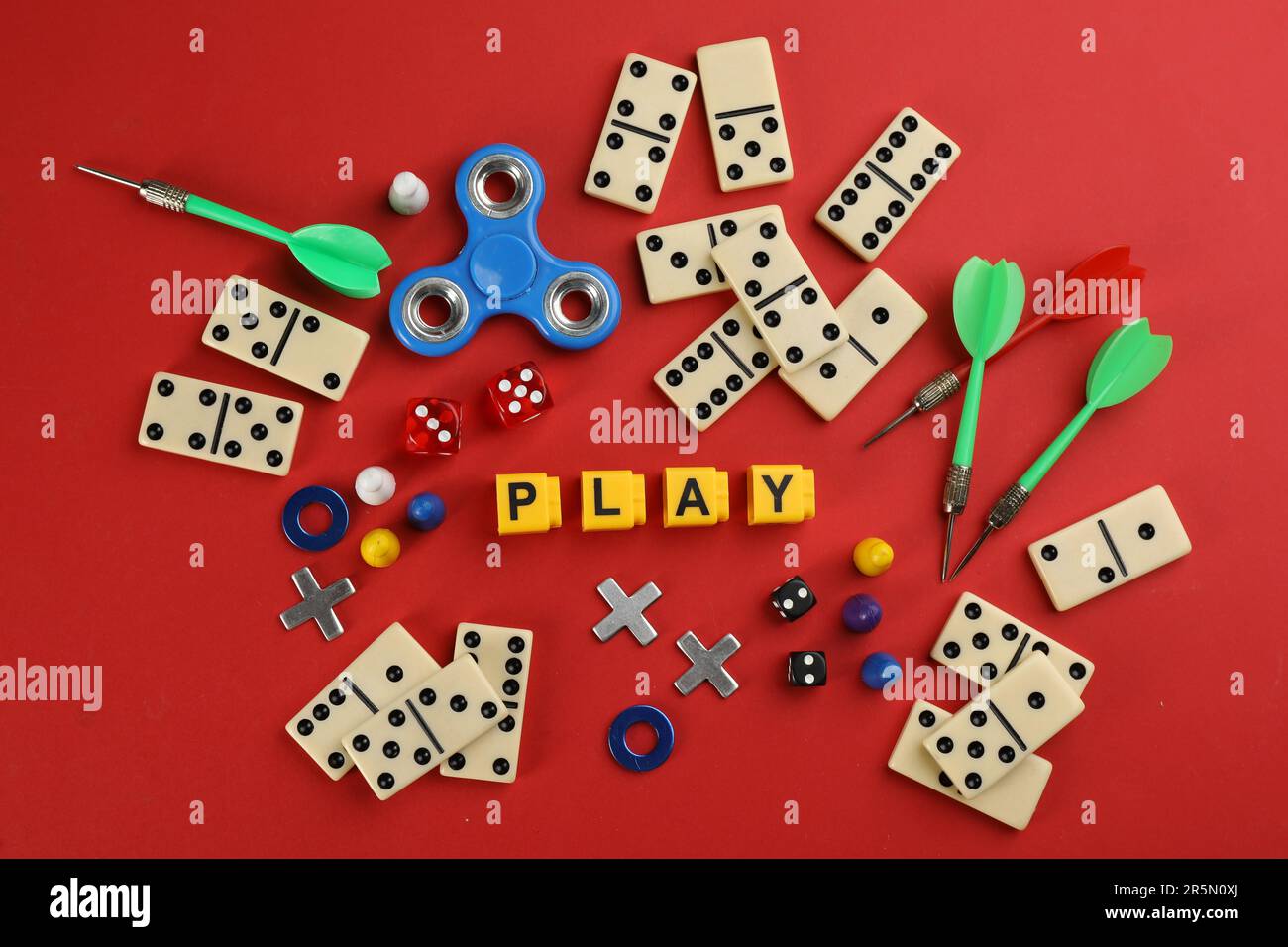 Components of board games and blocks with word Play on red background ...