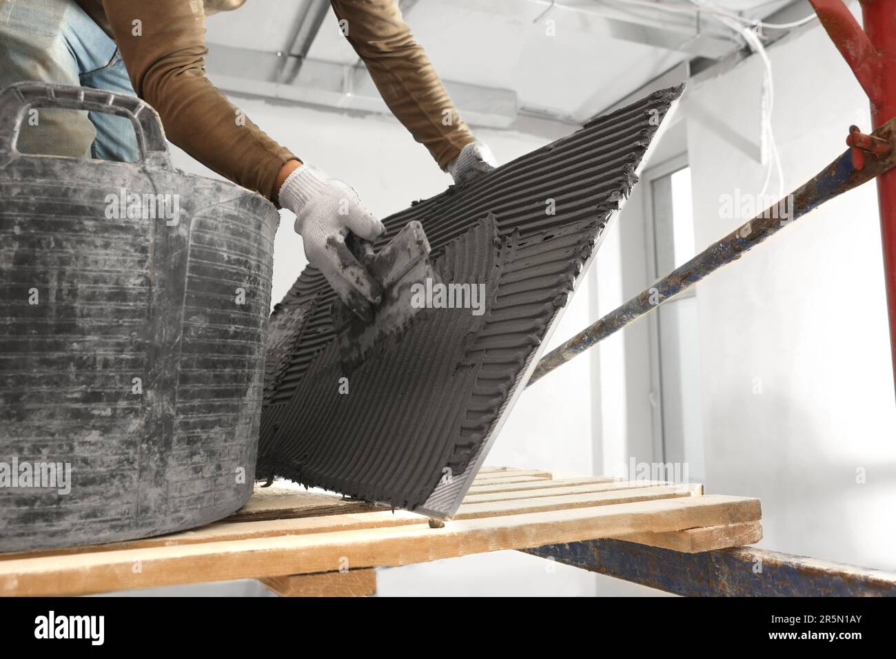 Construction worker putting cement in hi-res stock photography and ...