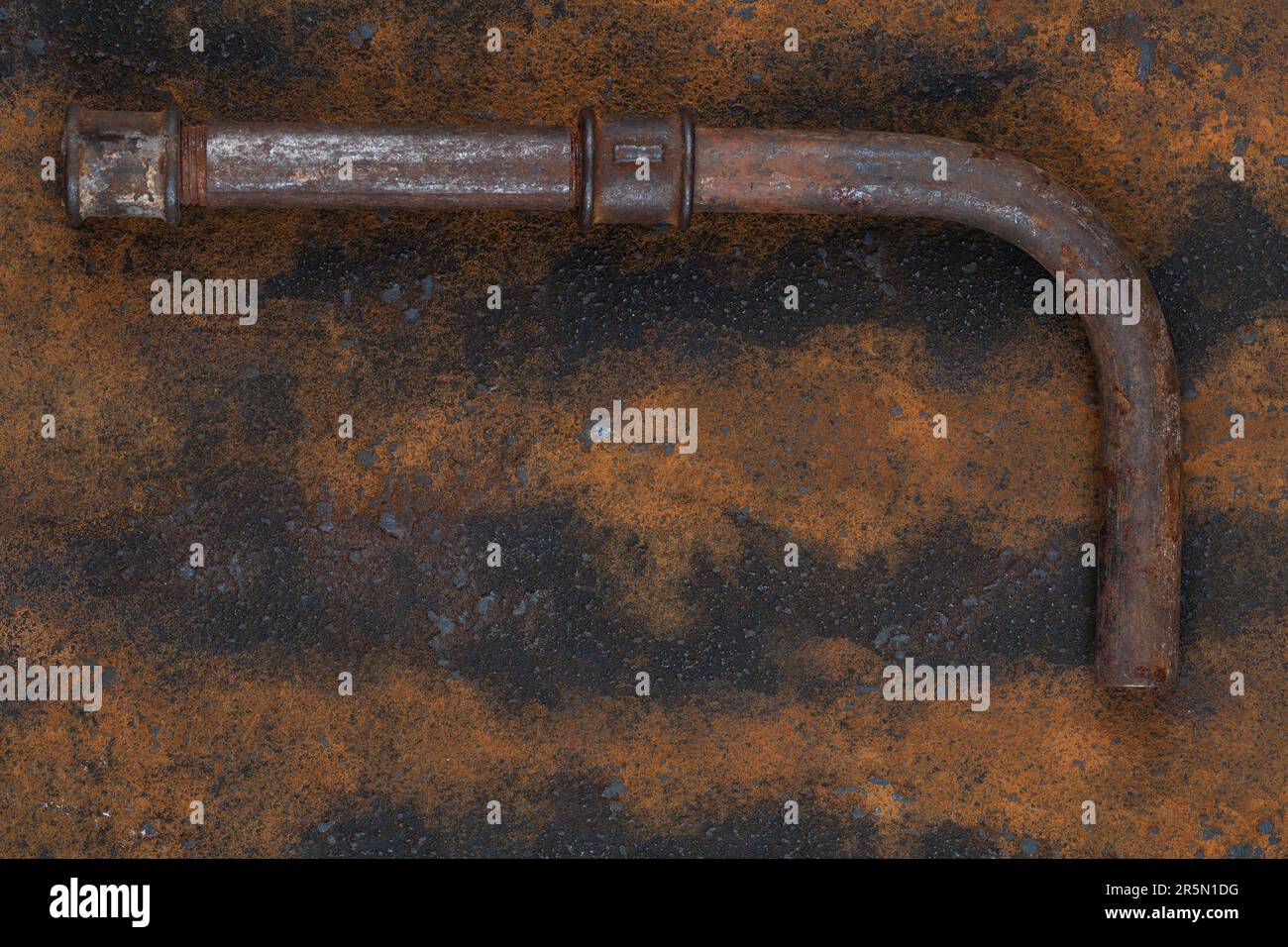 Rusty valve pipes on rusty metal wall background Stock Photo - Alamy