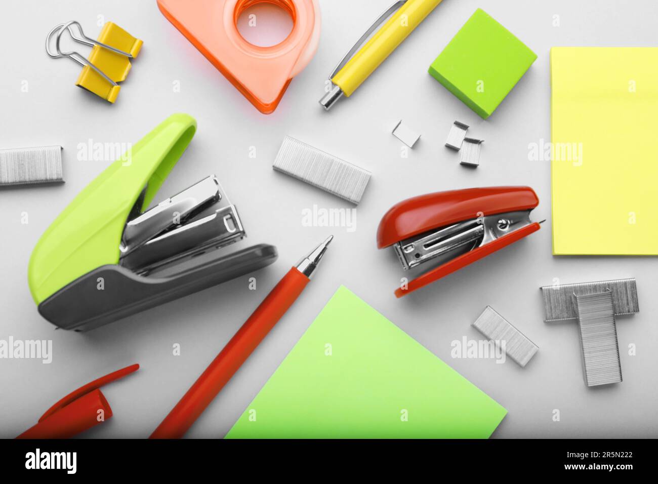 Flat lay composition with new staplers on light grey background Stock ...