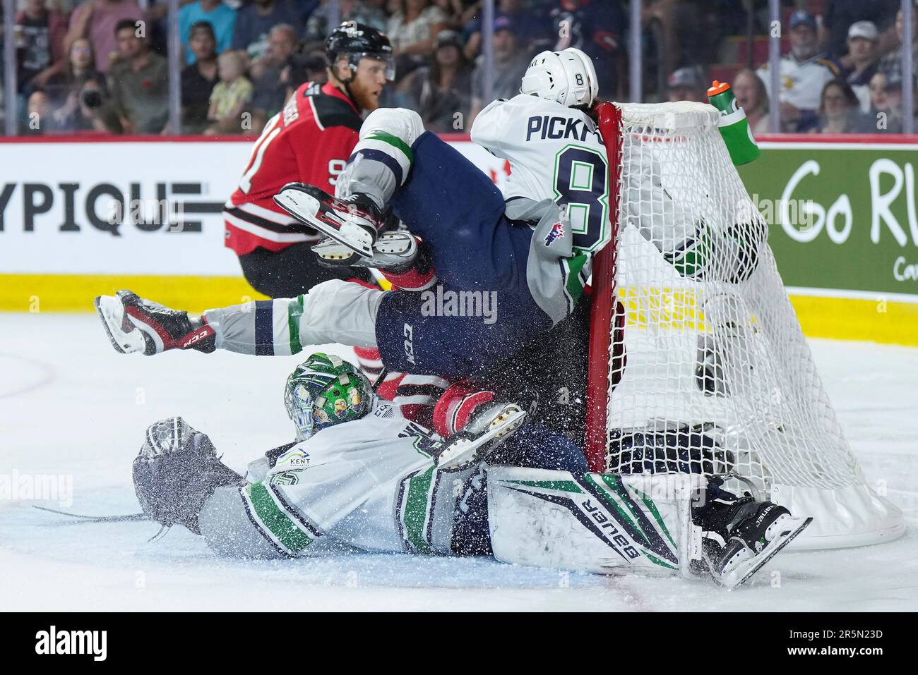 Seattle Thunderbirds' Bryce Pickford (8) checks Quebec Remparts' Pier ...