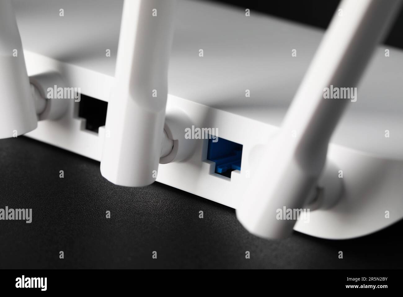 New white Wi-Fi router on black table, closeup Stock Photo - Alamy