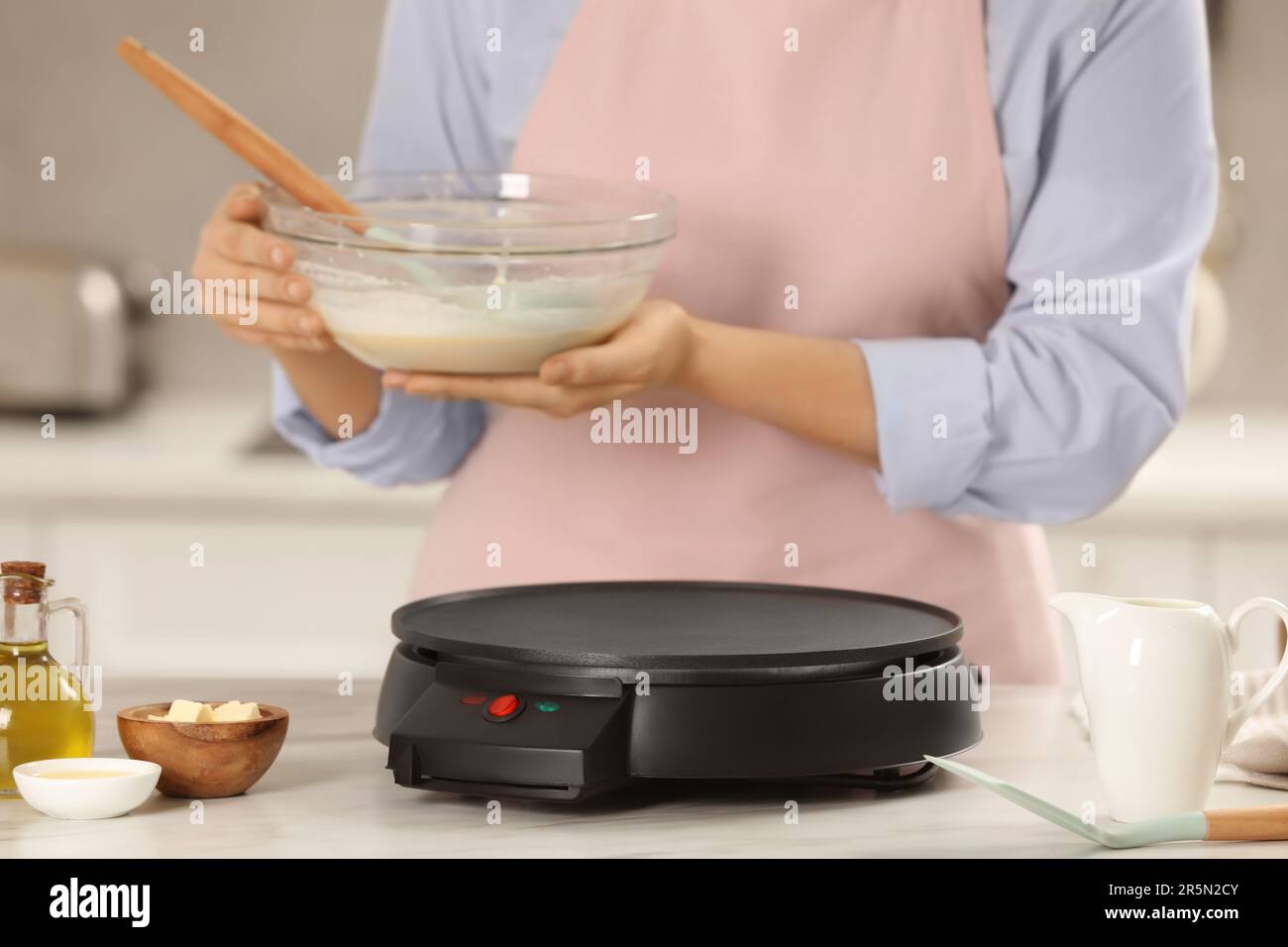 Woman dough crepes table hi-res stock photography and images - Alamy