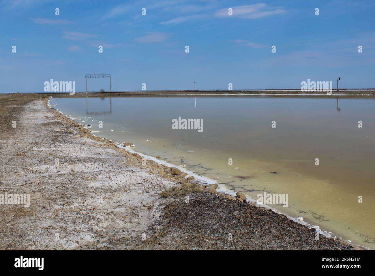 The stones are covered with a crust of salt on the shores of the salar ...