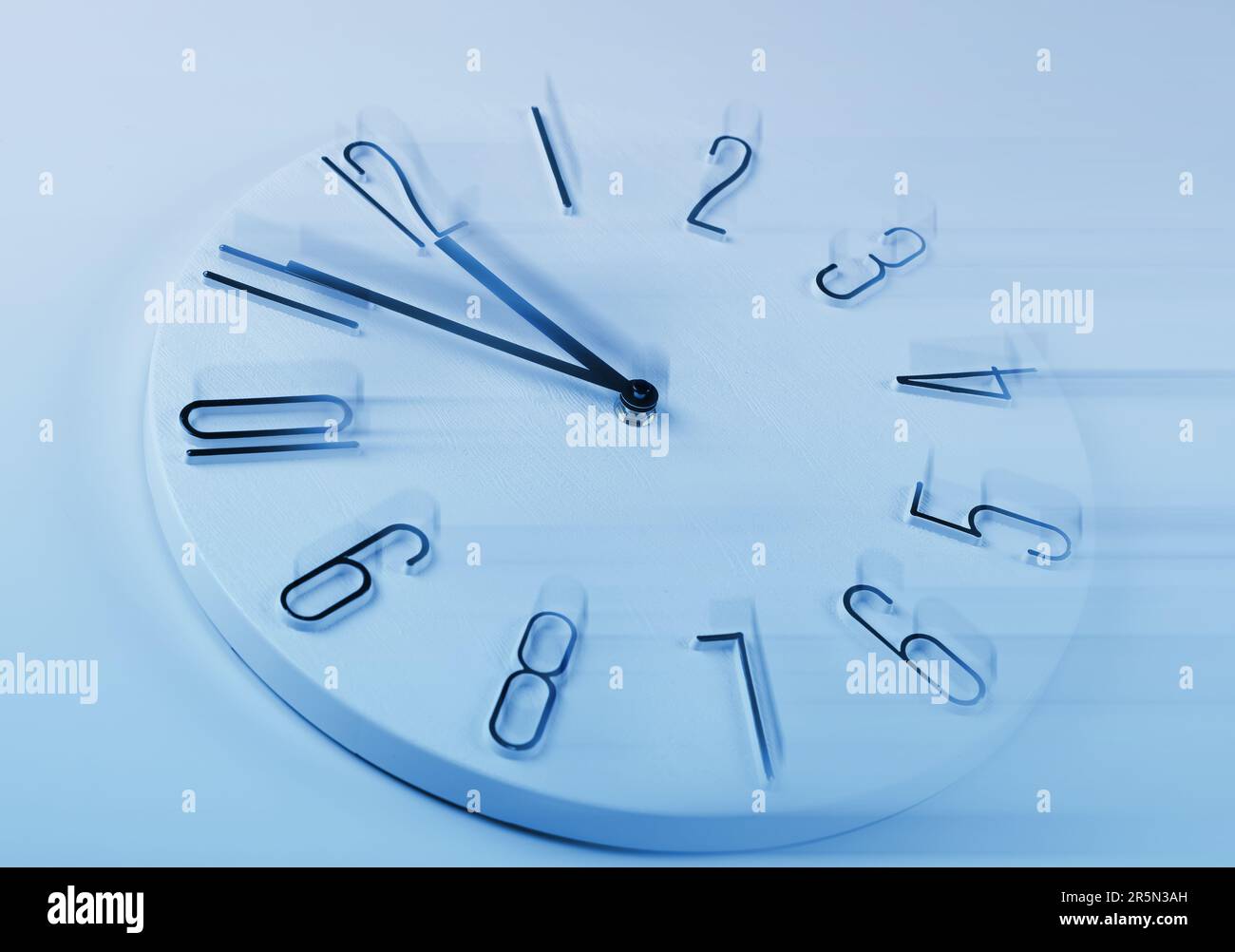 Fleeting time concept. Clock on light blue background, motion effect ...