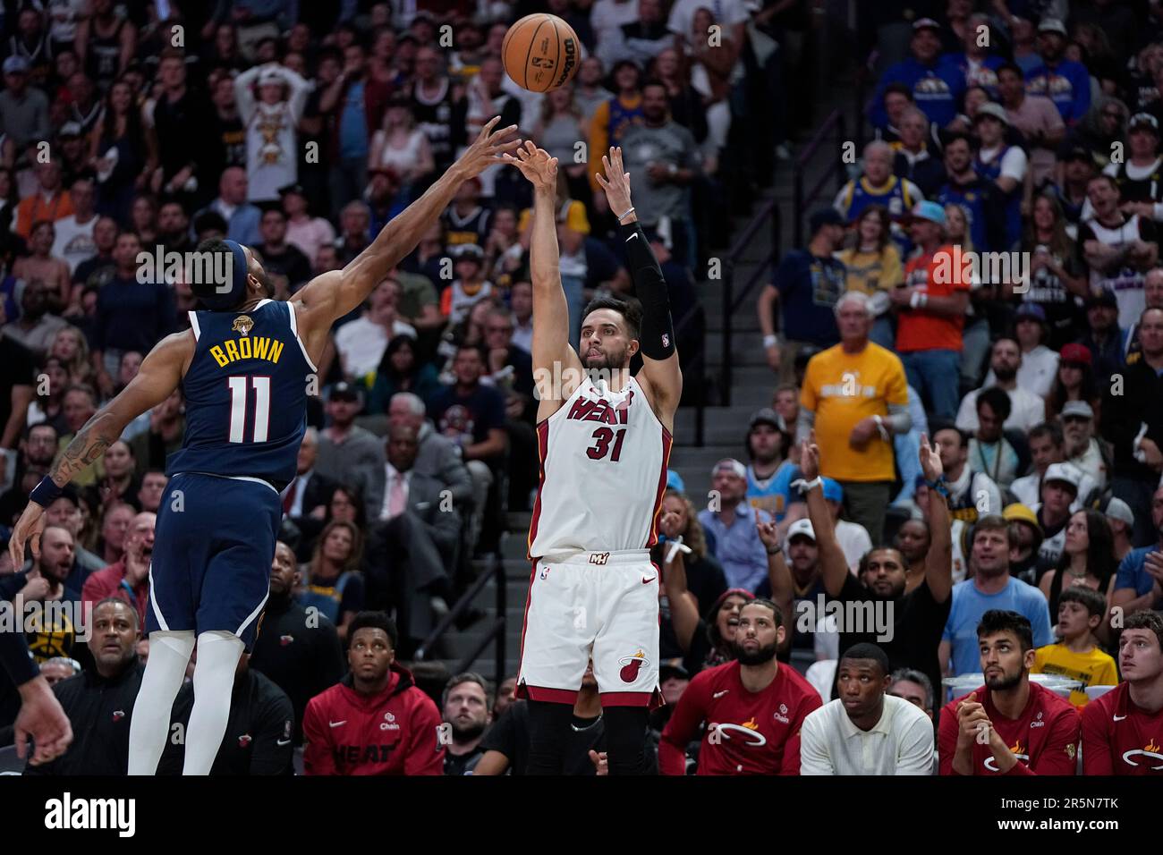 Miami Heat guard Max Strus (31) shoots over Denver Nuggets forward ...