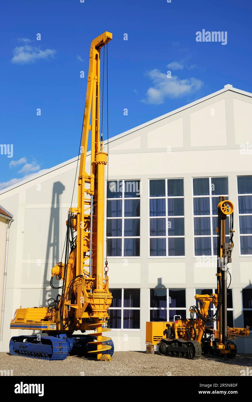 Construction machinery in front of a building Stock Photo - Alamy