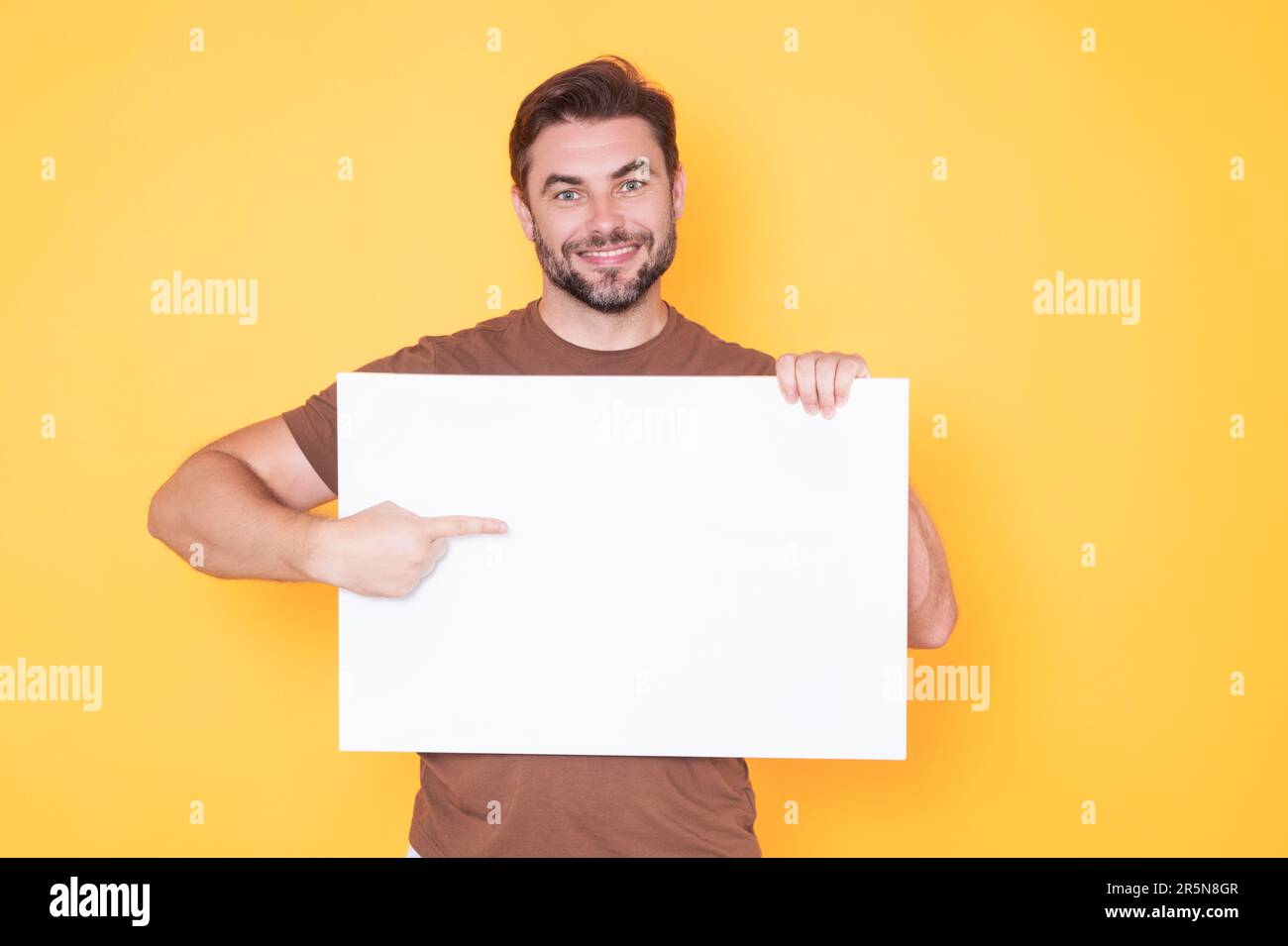 Information concept. Man with blank placard. Demonstrating copy space ...