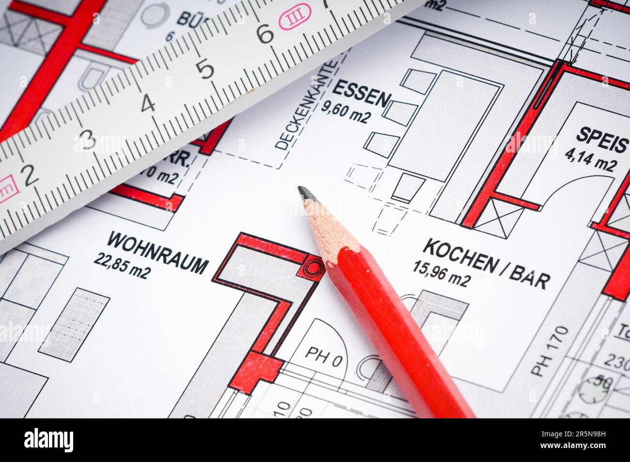 Red pencil with ruler on a house plan Stock Photo - Alamy