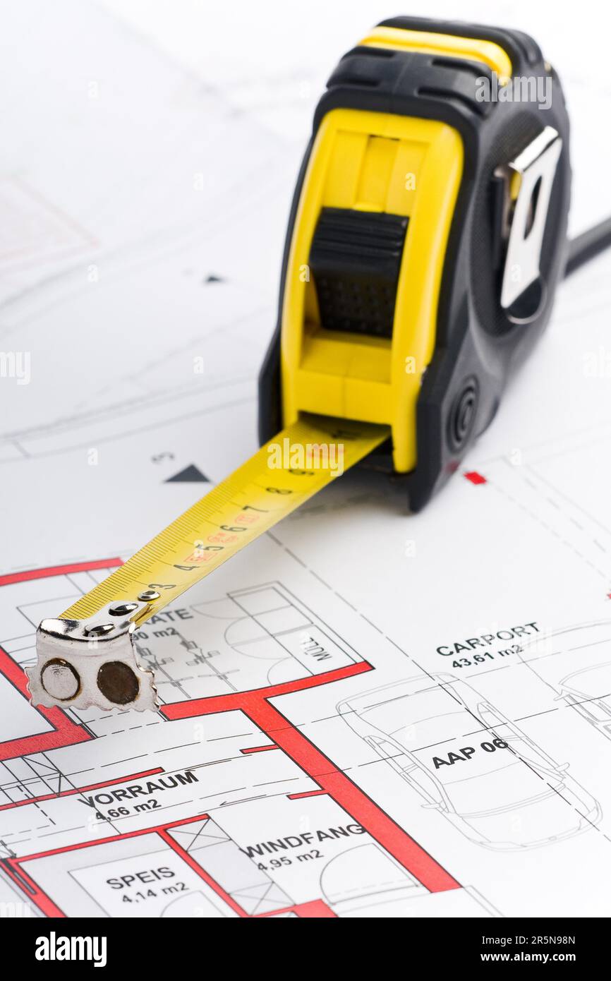 A rolling metre on a house plan to measure Stock Photo - Alamy