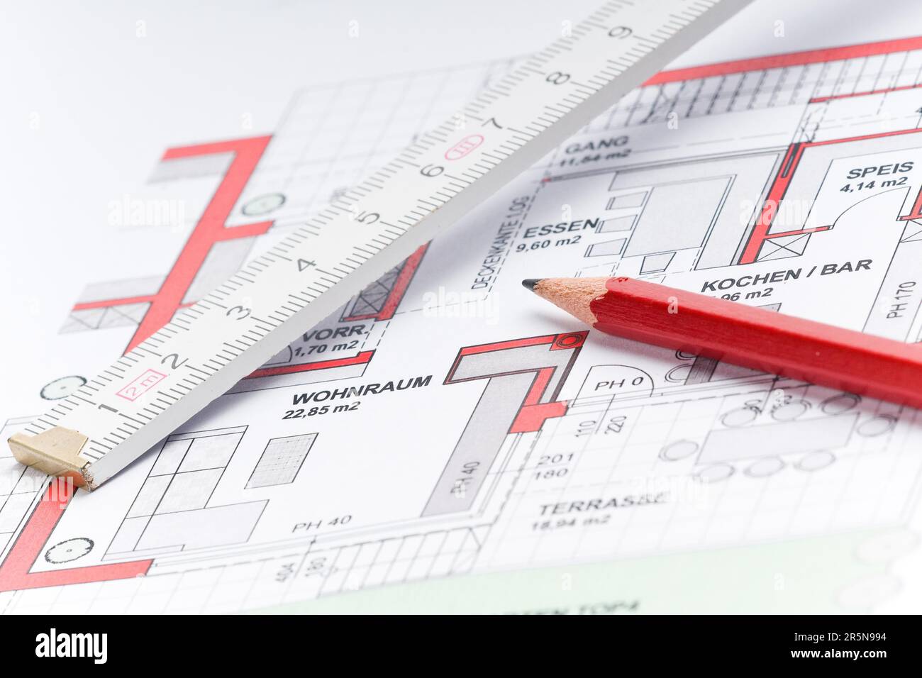 Red pencil with ruler on a house plan Stock Photo - Alamy
