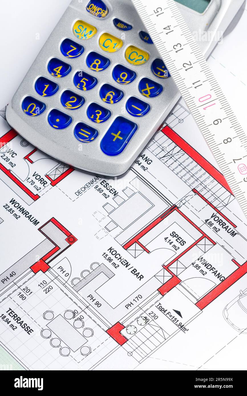 Calculator and ruler on a house plan for calculating Stock Photo - Alamy