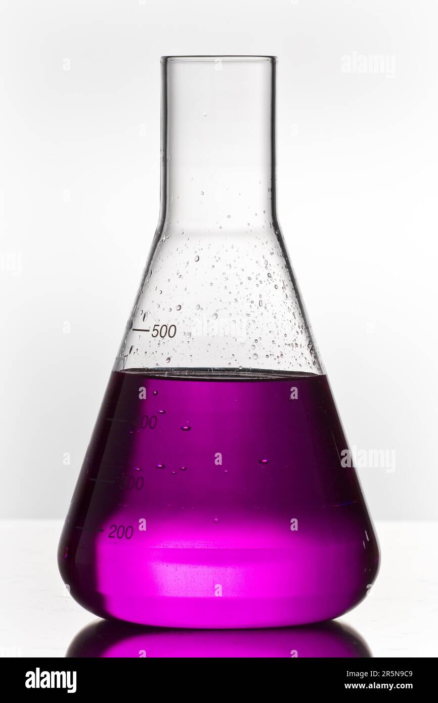 Empty chemical jar filled with violet liquid Stock Photo - Alamy