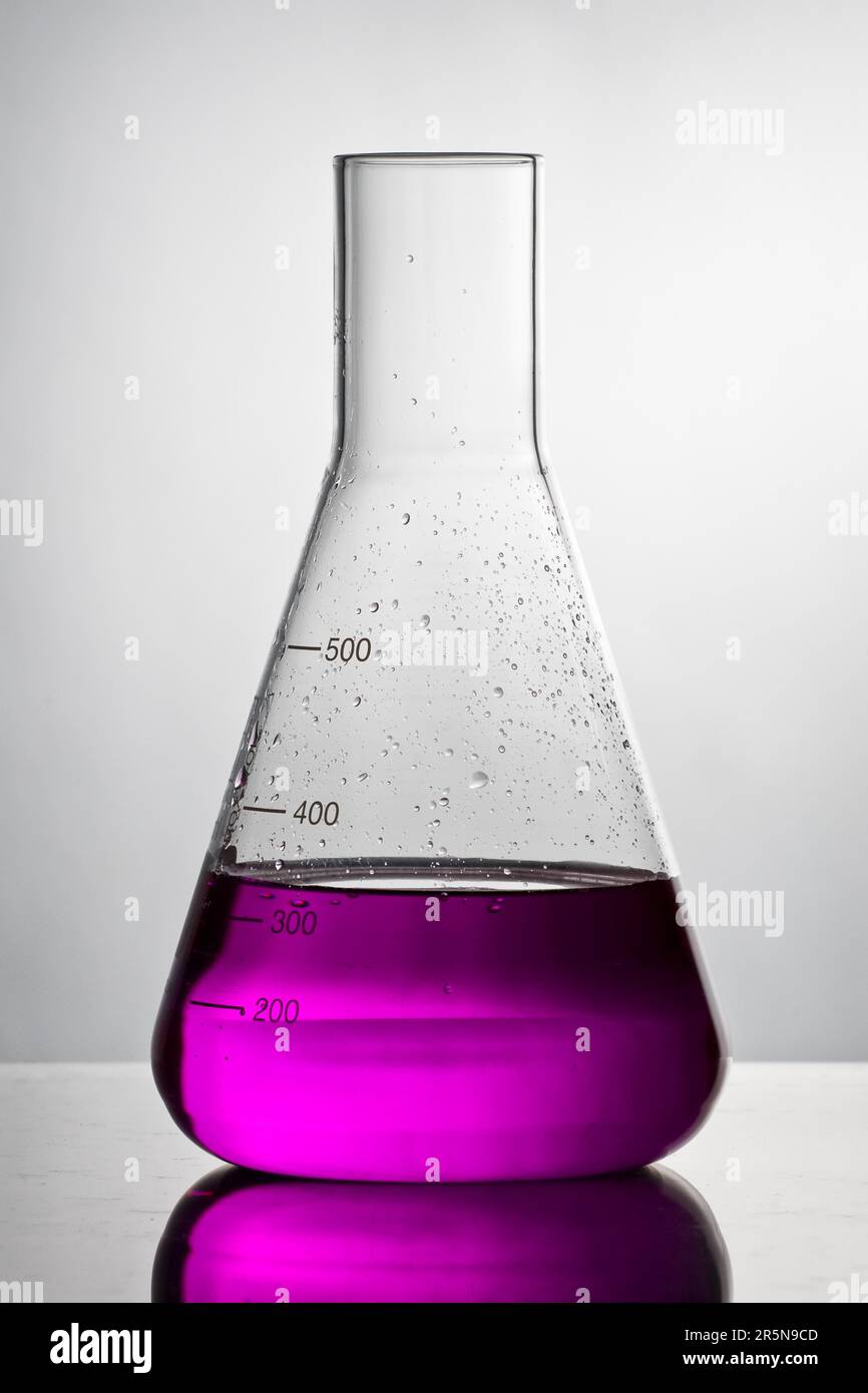 Empty chemical jar filled with violet liquid Stock Photo - Alamy
