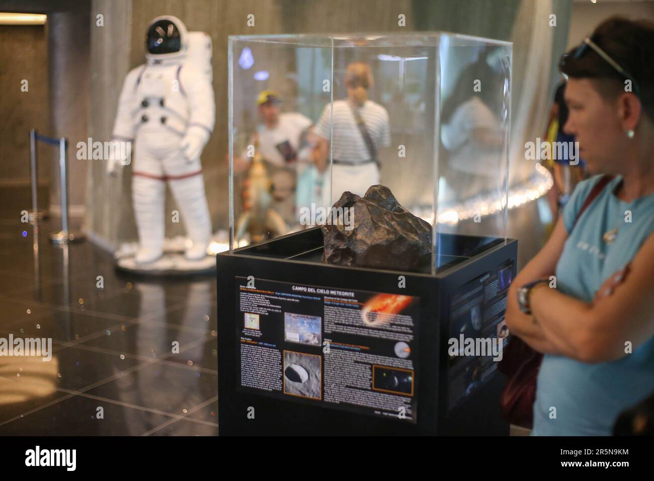 Nicosia, Cyprus. 4th June, 2023. A woman views a piece of meteorite ...