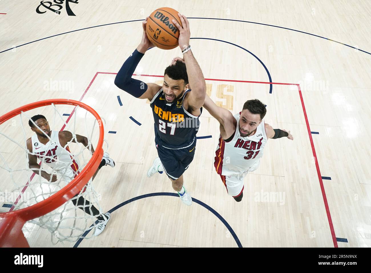 Denver Nuggets guard Jamal Murray (27) dunks while defended by Miami ...