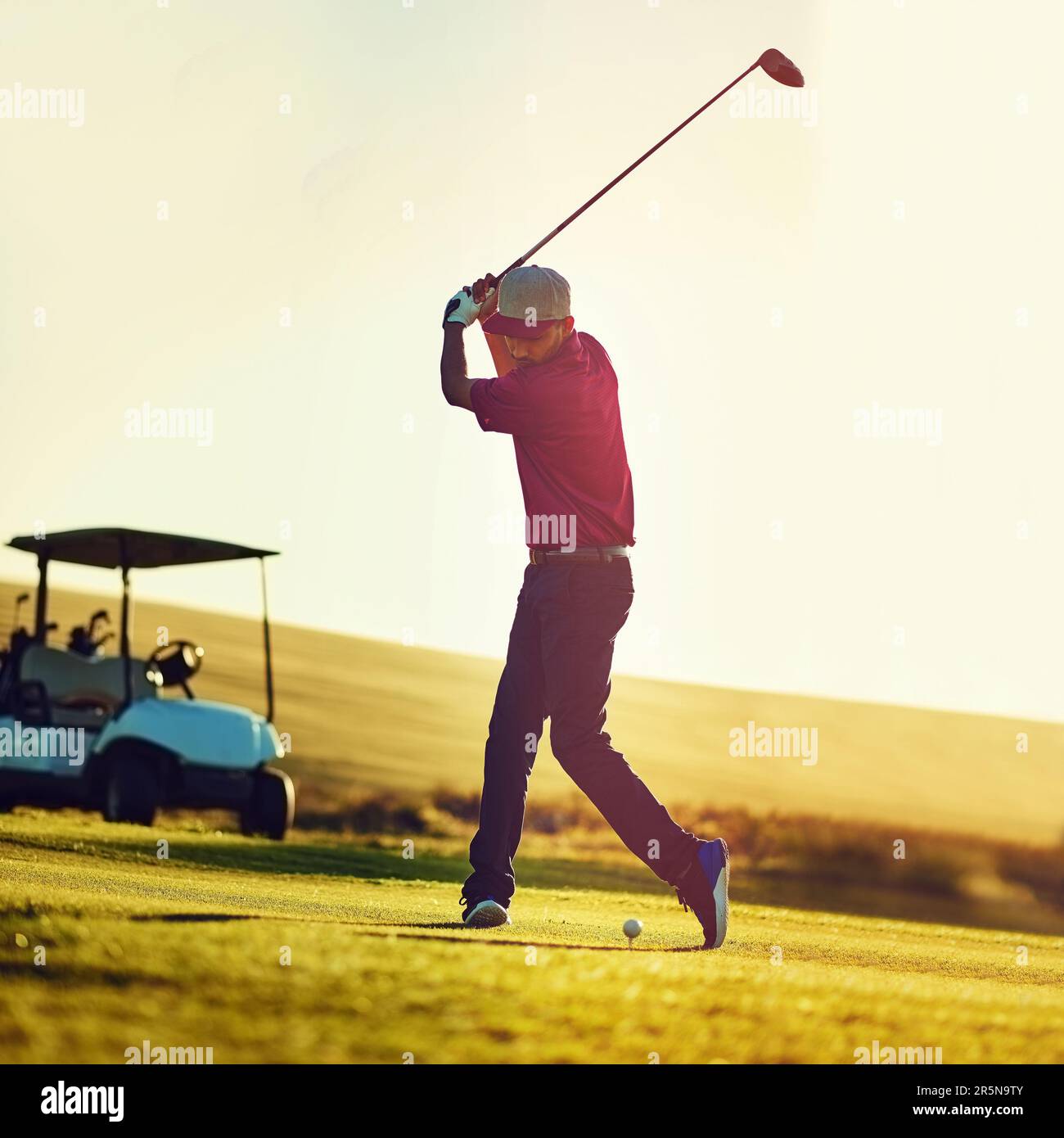 The technique golfing legends are made of. a young man playing golf ...