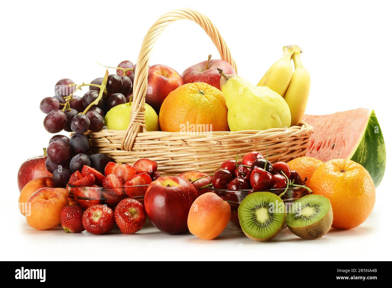 Composition with variety of fruits and wicker basket Stock Photo - Alamy