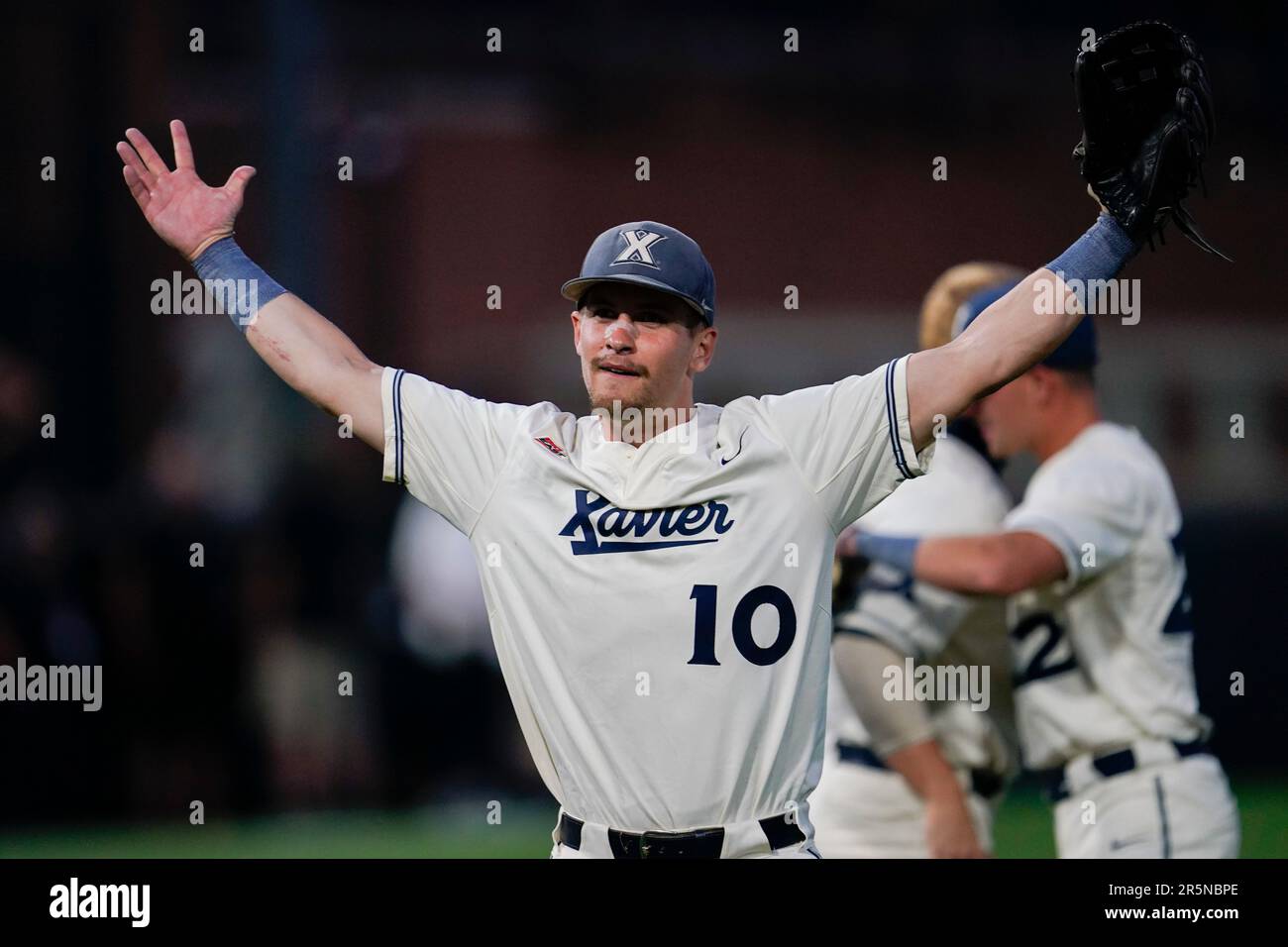 Xavier center fielder Garrett Schultz (10) celebrates after his team's ...