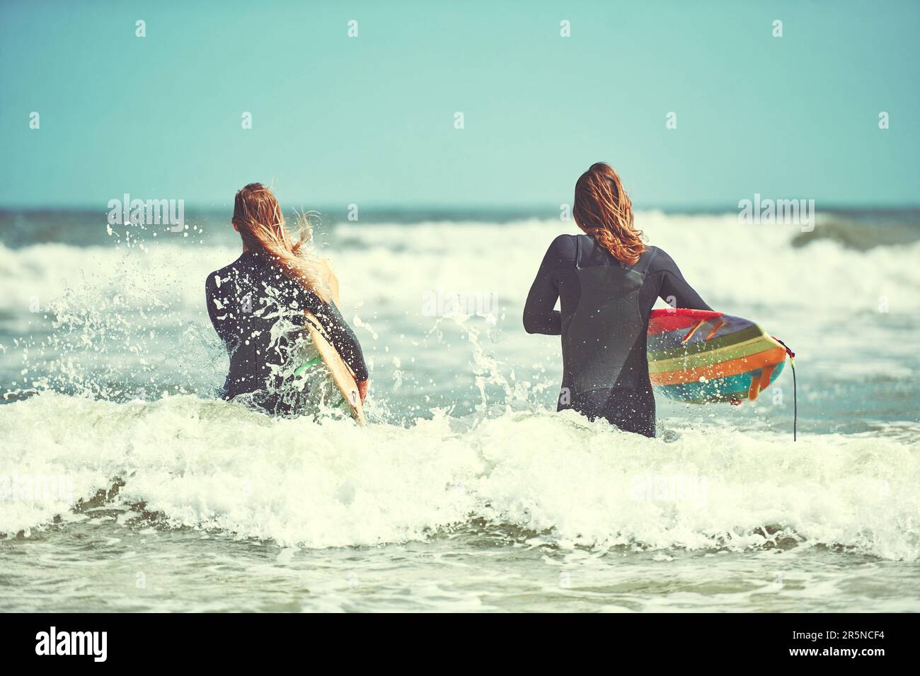 Couples who surf together stay together. a young couple surfing at the ...