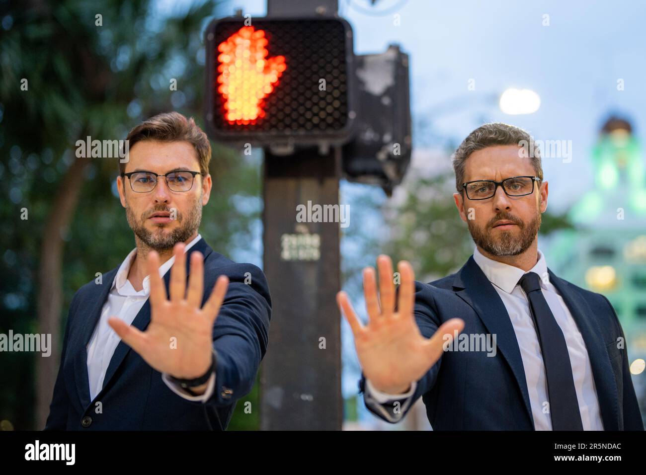 Business men doing stop sing with hand. Warning expression with ...