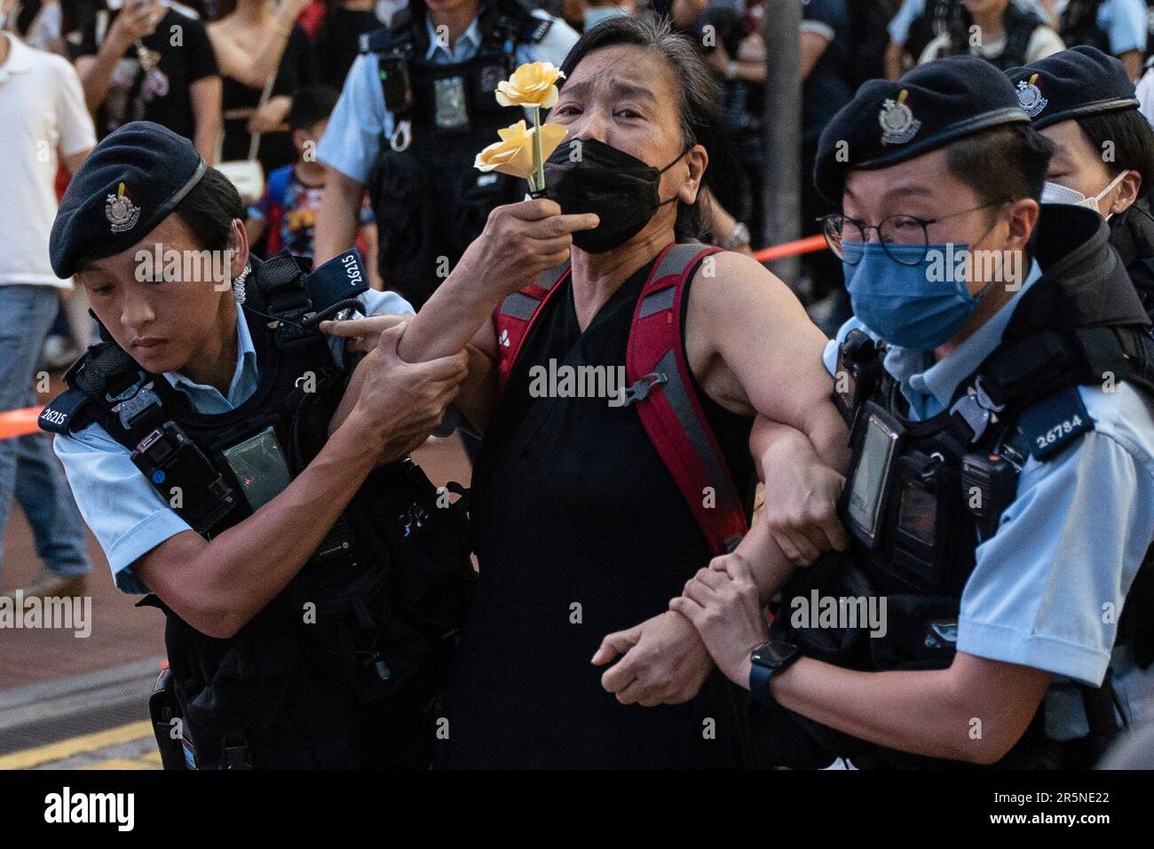 Police officers detain Chan Po-Ying, chairperson of the League of ...