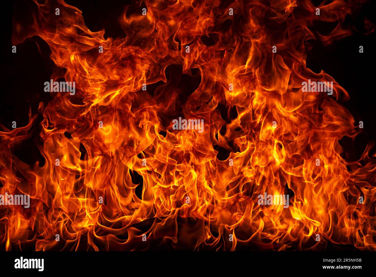 Texture of fire on a black background. Abstract fire flame background ...