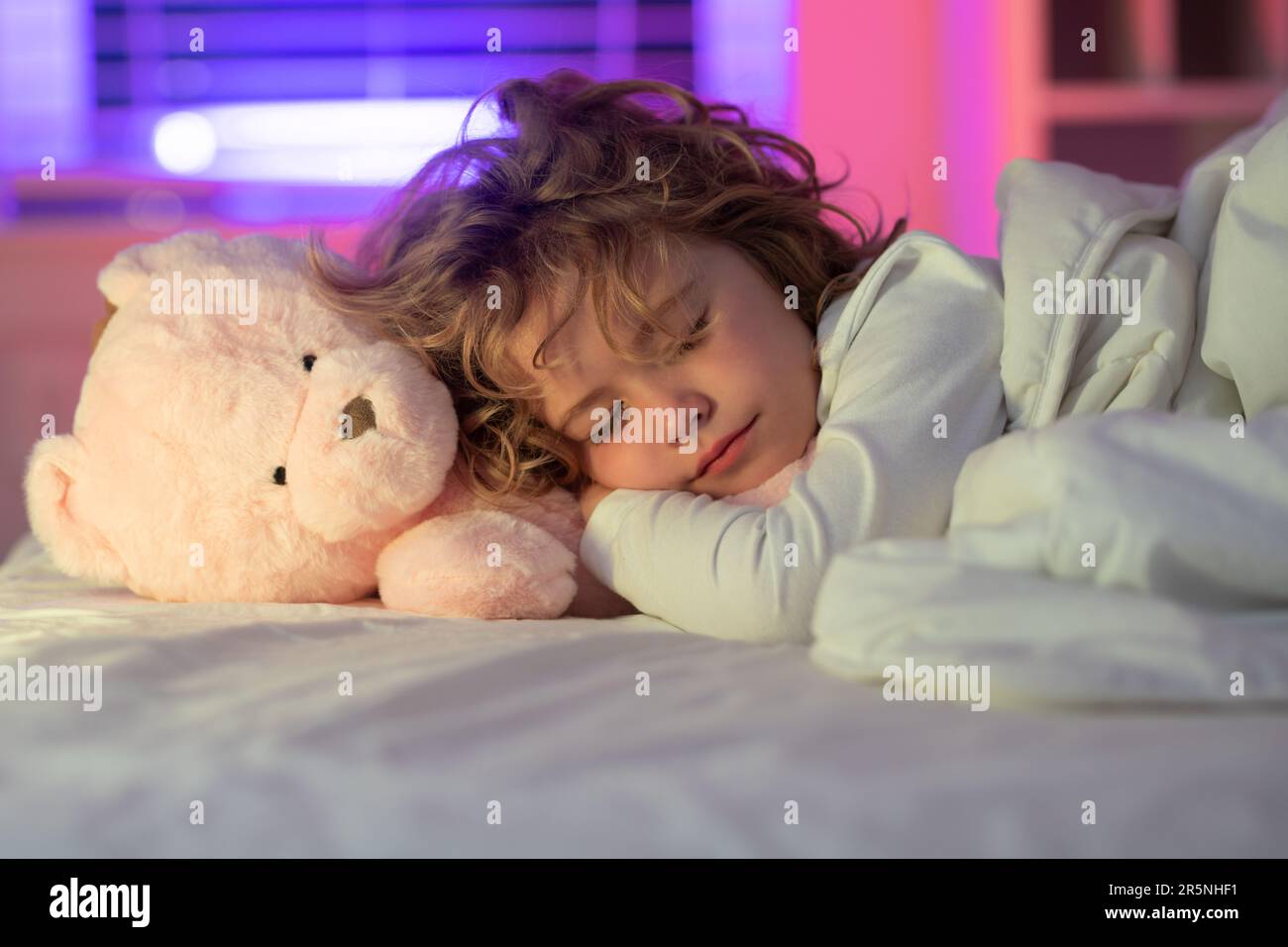Calm kids sleep. Child boy sleep with a toy teddy bear, napping. Kid ...