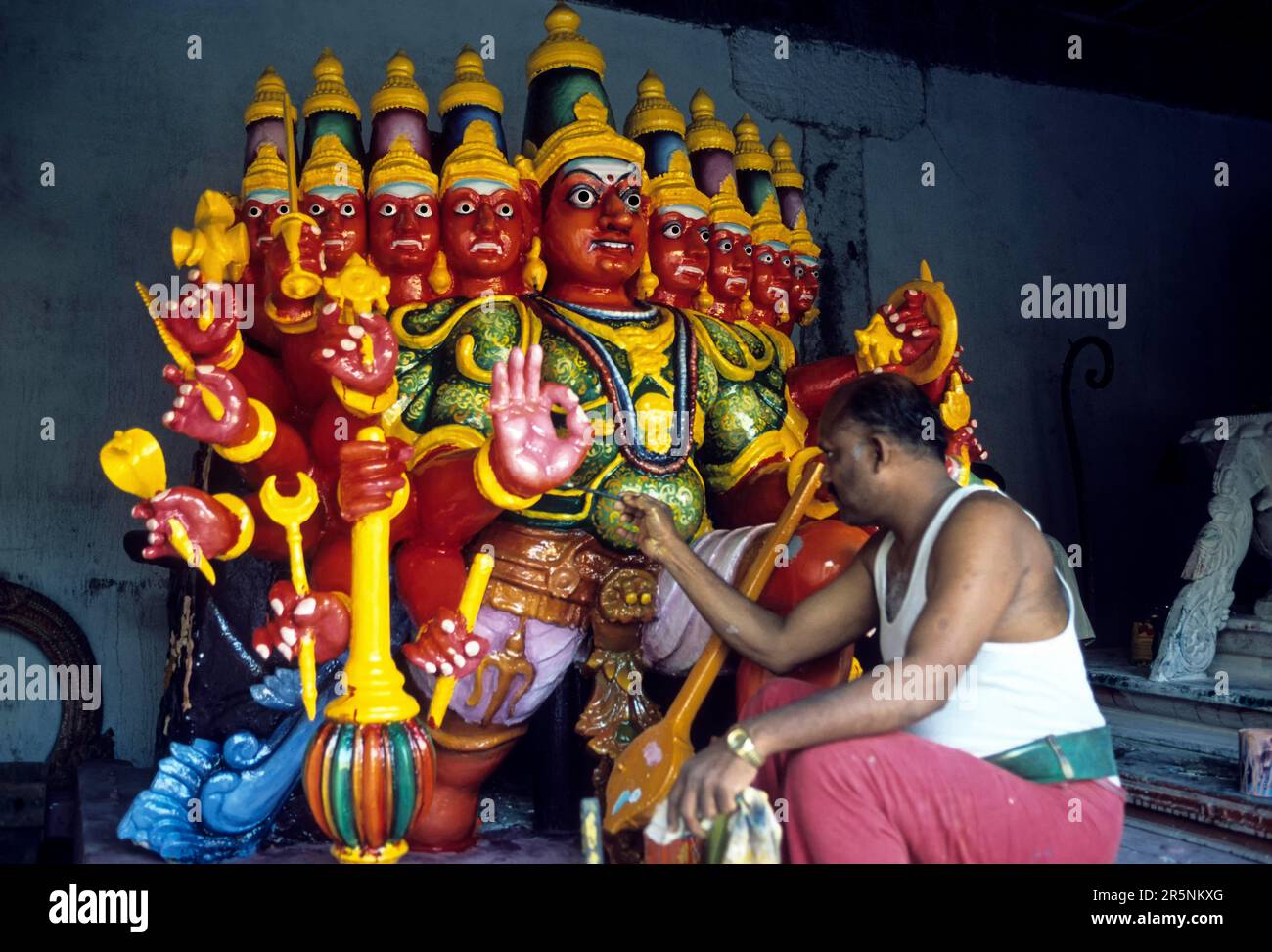 Man Coloring the wooden statue of Ravanan, Chennai, Tamil Nadu, India ...
