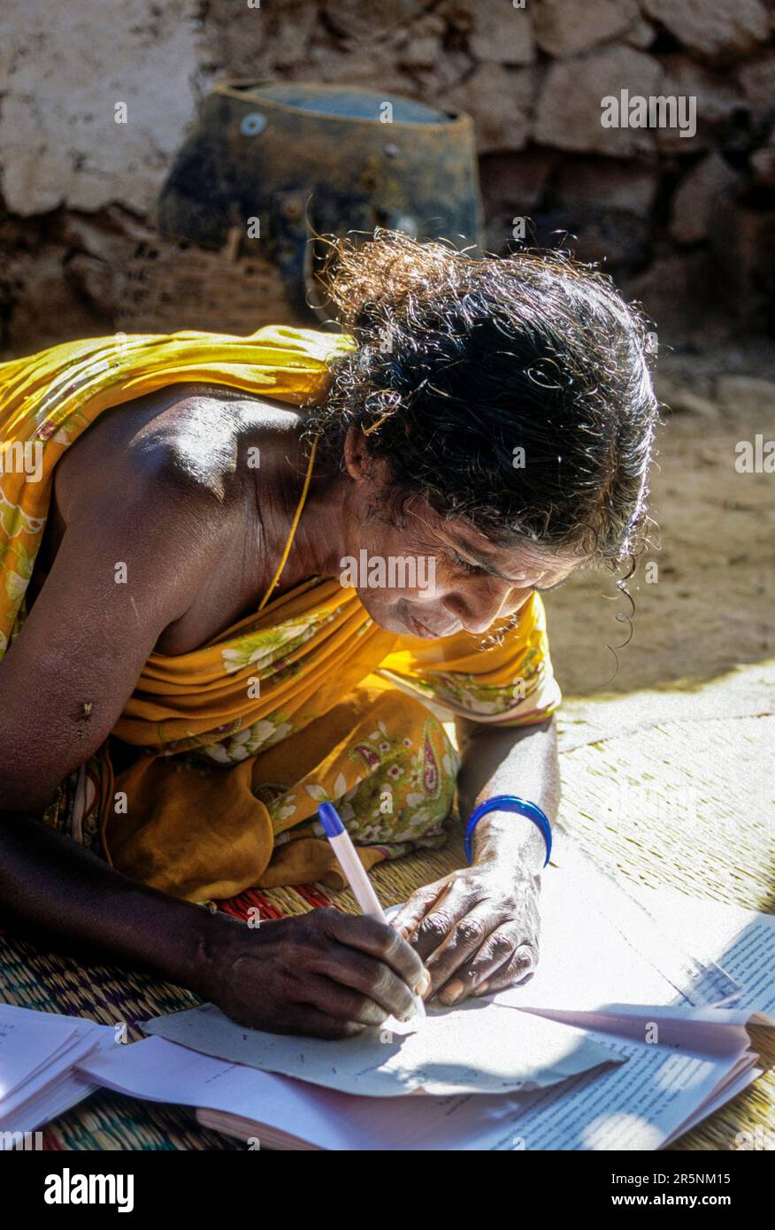 A tribal old woman studying under elderly education scheme at Anaikatty ...