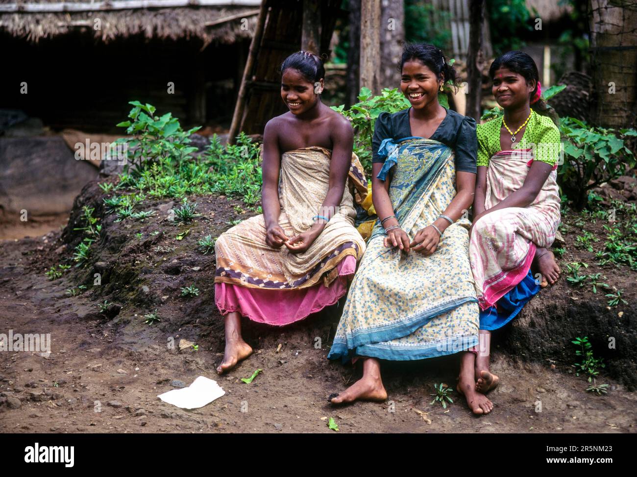 Betta kurumba tribal girls sitting the tribal settlement at Theppakadu in Mudumalai National ...