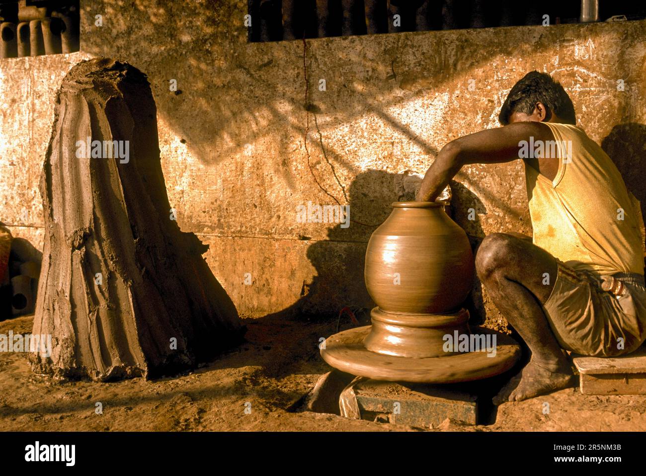 A man making Ghatam percussion instrument at Manamadurai, Tamil Nadu ...