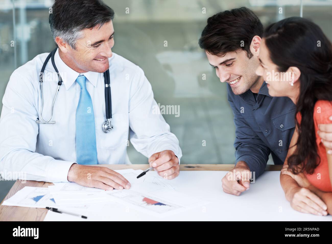 Youre both in great shape...A young couple meeting with a doctor for a ...