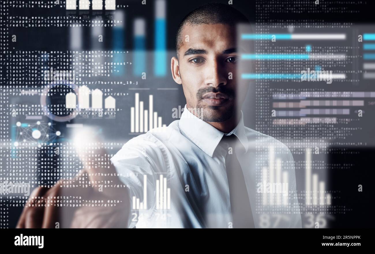 Touching the future. a handsome young businessman using a digital ...