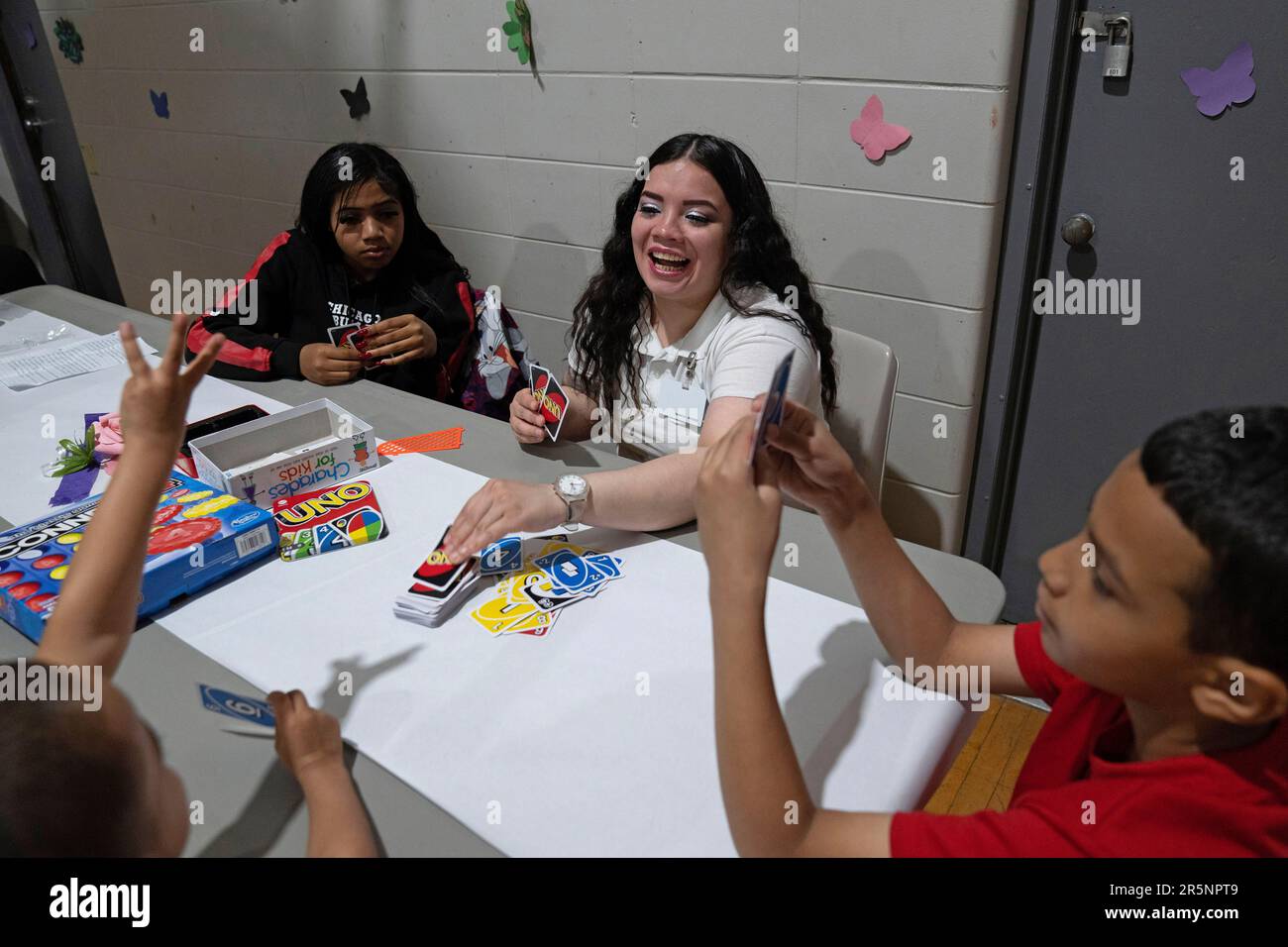 Crystal Martinez, center, plays Uno with three of her five children ...