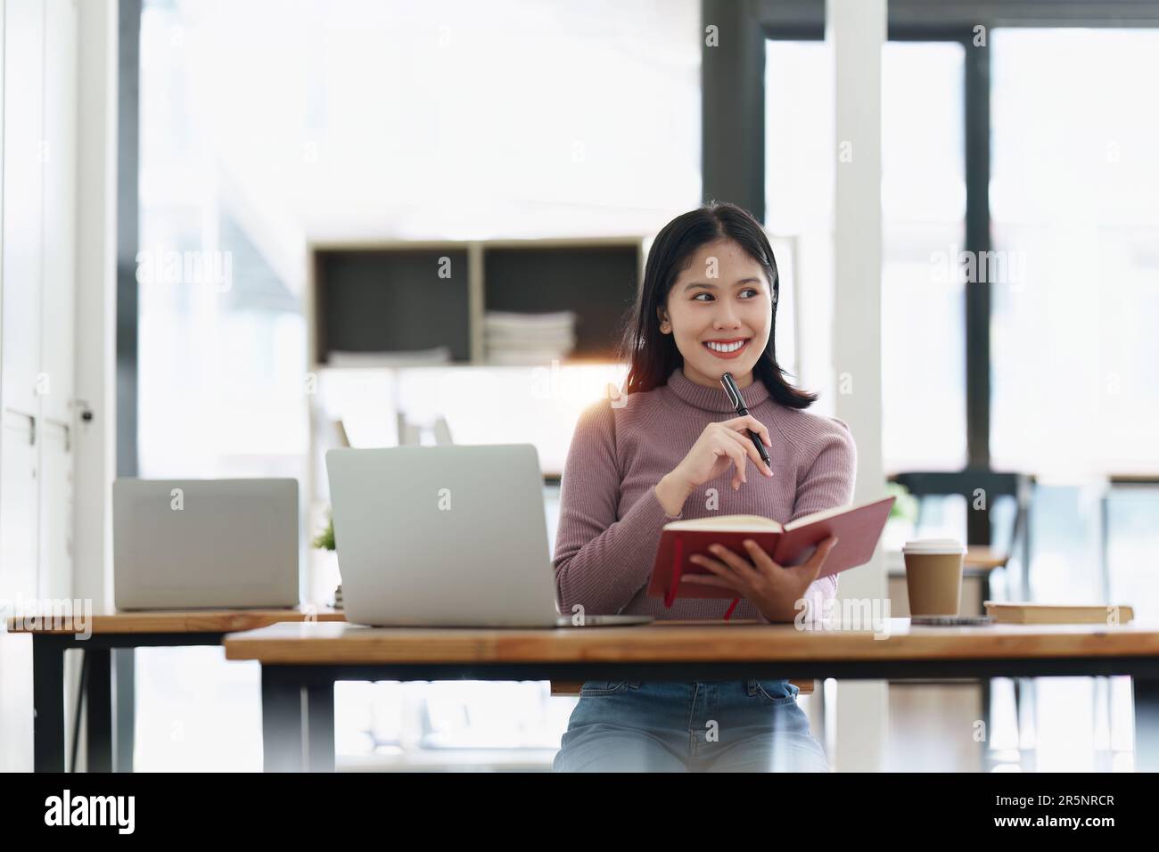 Young student studying in classroom at college. Student working at ...