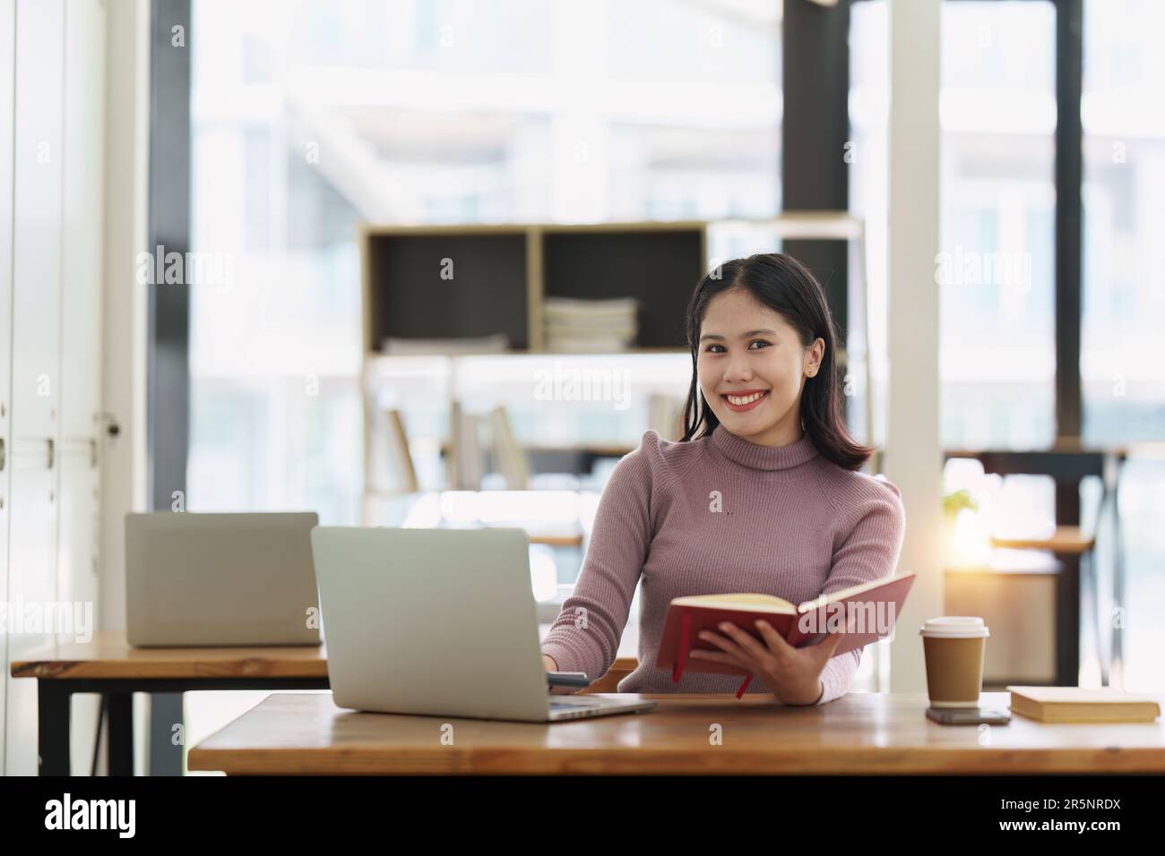Young student studying in classroom at college. Student working at ...