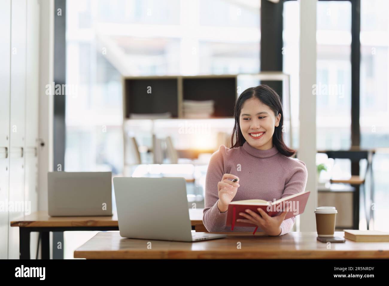 Young student studying in classroom at college. Student working at ...