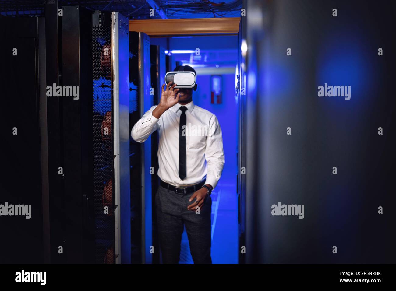 Experience the future of connectivity. a young man wearing a VR headset ...